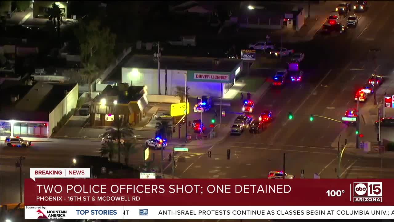 One officer in critical condition, one released after Phoenix police ...